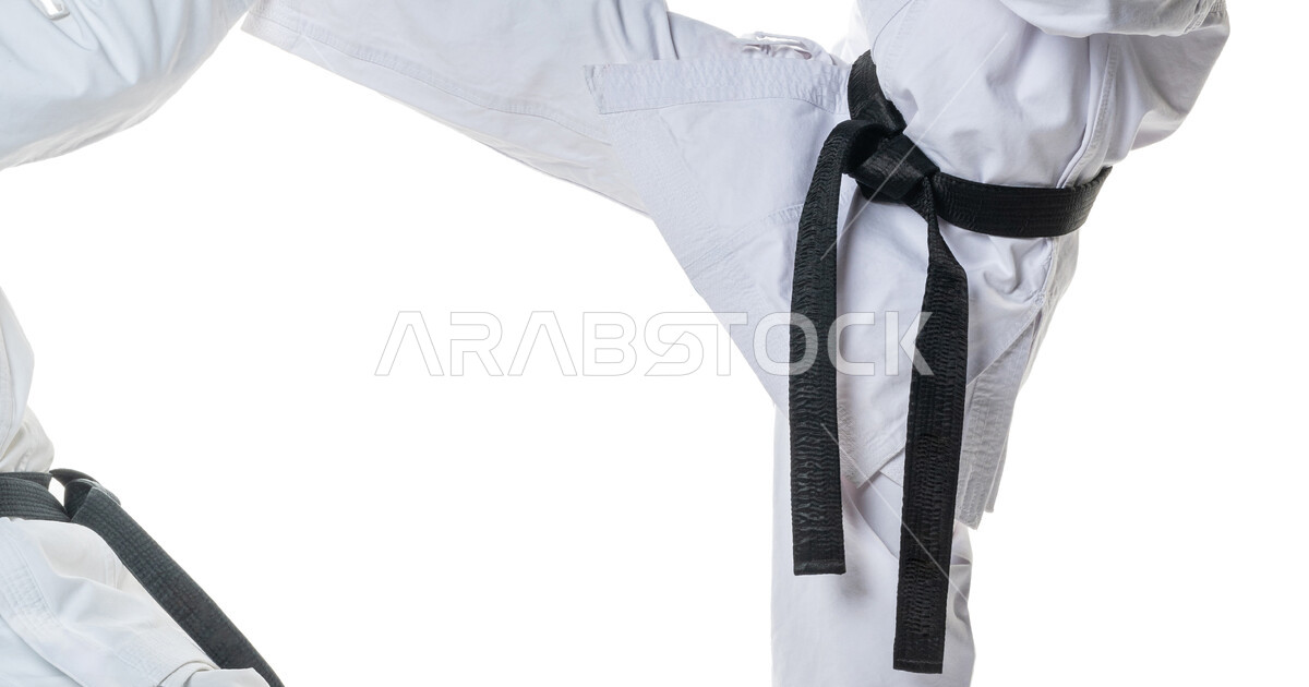 Portrait of a Saudi Arabian Gulf man training a child in karate ...