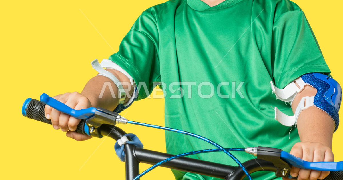 Portrait of a Saudi Arabian Khaleeji child wearing sportswear and a ...