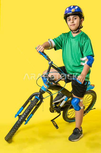 Portrait of a Saudi Arabian Khaleeji child wearing sportswear and a ...