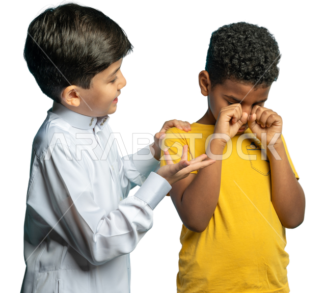 Portrait of a Saudi Arabian Gulf child consoling his sad friend, trying ...