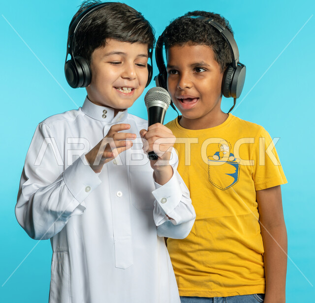 Portrait of two Saudi Arabian Gulf children, two friends wearing ...