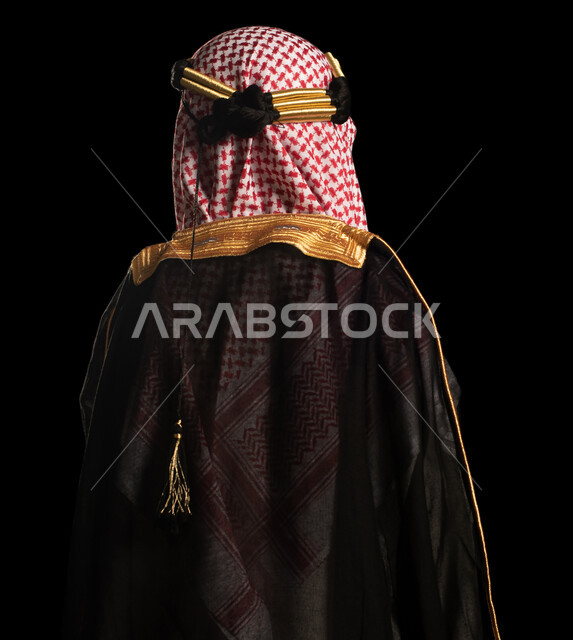 Portrait from the back of a Saudi Arab Gulf boy wearing the Saudi bisht ...