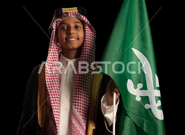 Portrait of a Saudi Arabian Gulf boy wearing the Saudi bisht and ...