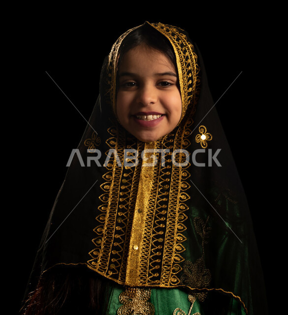 Portrait of a Saudi Arabian Gulf girl wearing a traditional costume for ...