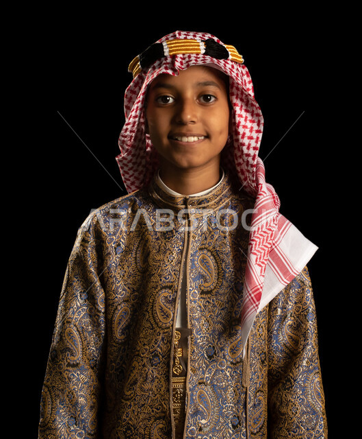 Portrait of a Saudi Arab Gulf boy wearing a traditional costume for ...