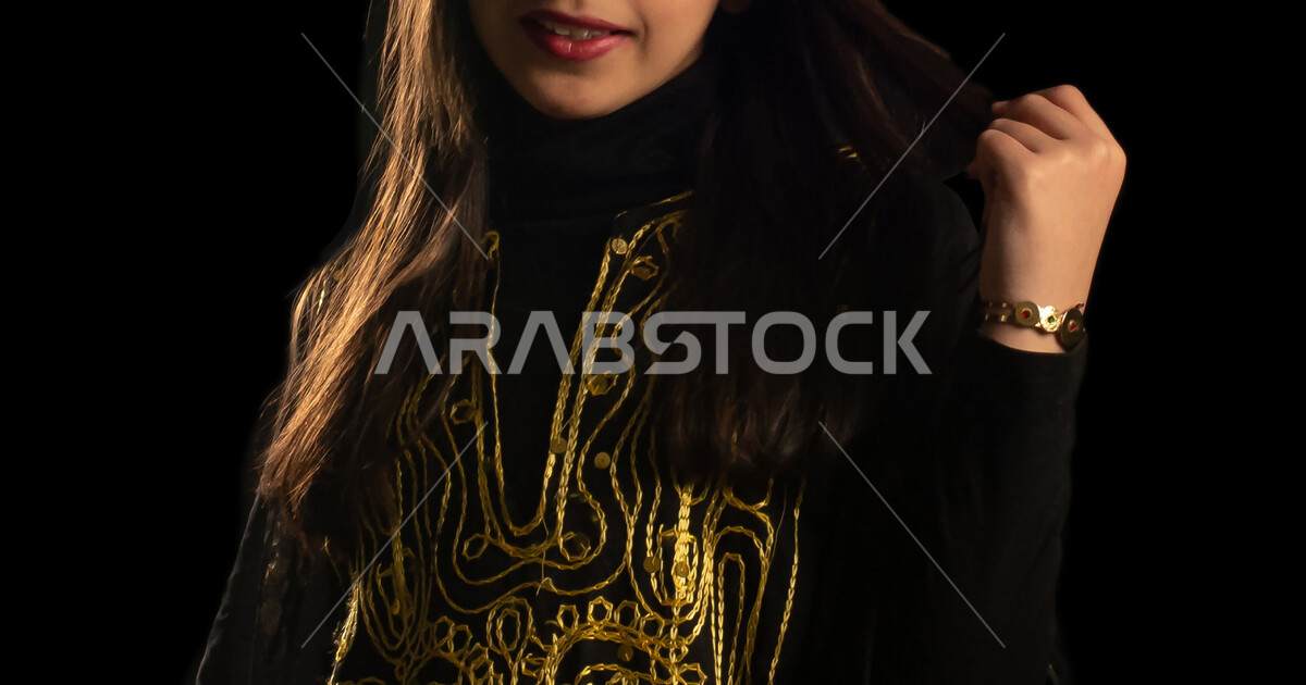 Portrait of a Saudi Arabian Gulf girl wearing a traditional costume for ...