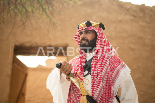 A Saudi Arabian Gulf man wearing the traditional Saudi folk costume ...