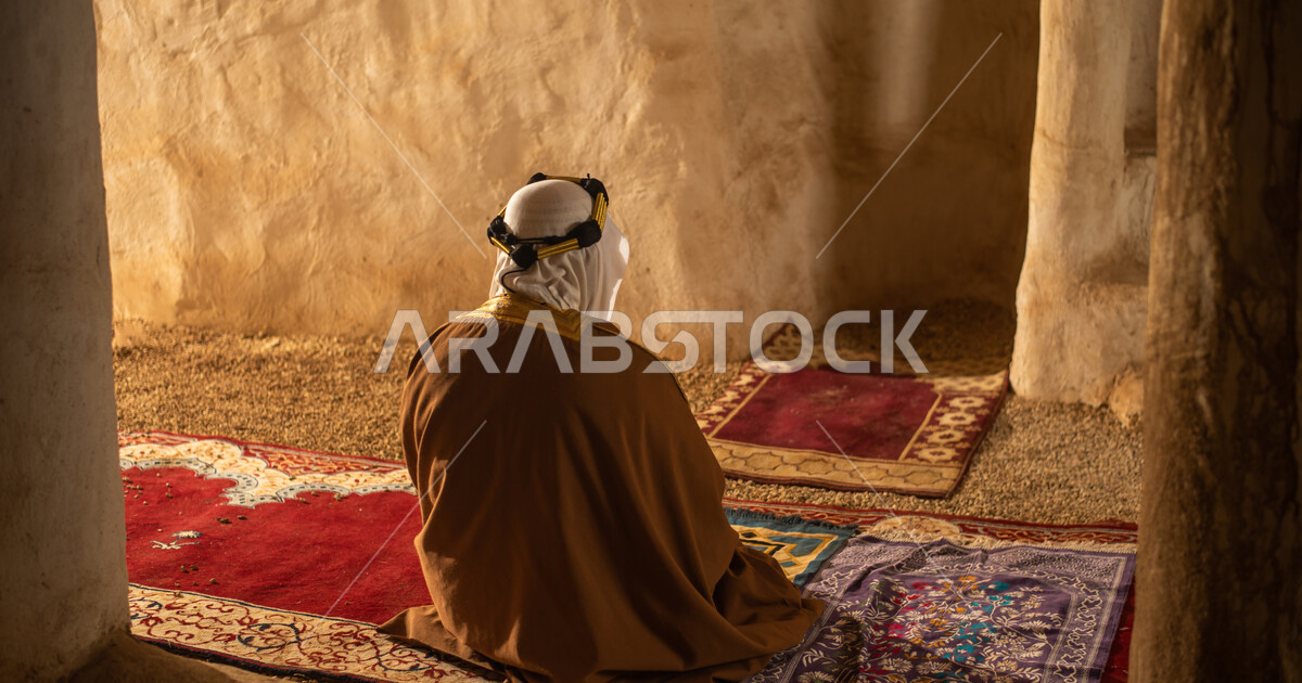 A picture from the back of an elderly Saudi Arabian Gulf man wearing ...