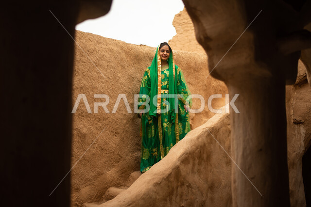 An Arab, Saudi, Gulf girl wearing the traditional Saudi folk costume ...