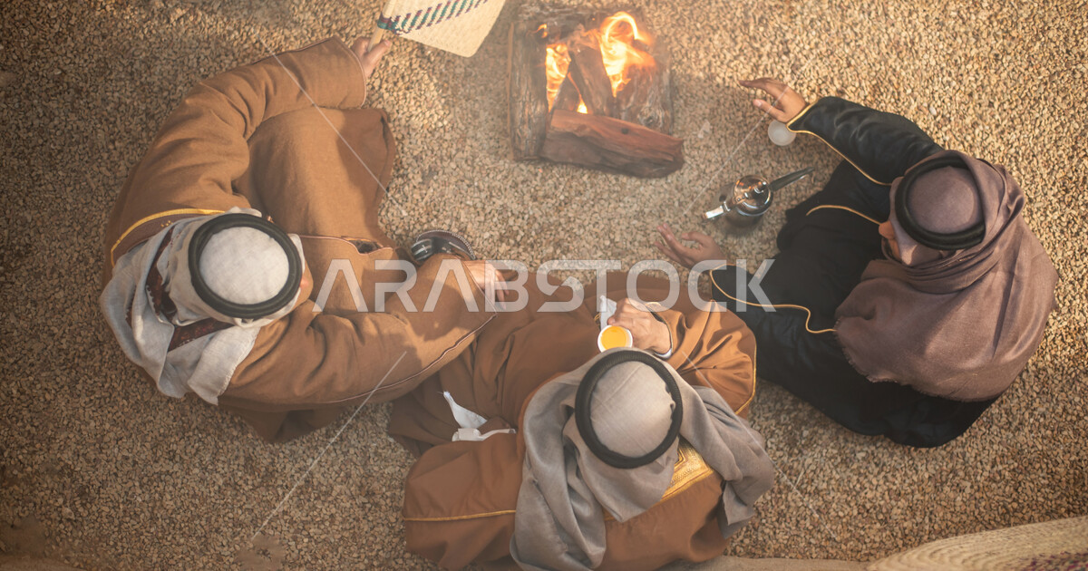 A picture from above of a group of Saudi Arab men, sitting in the ...