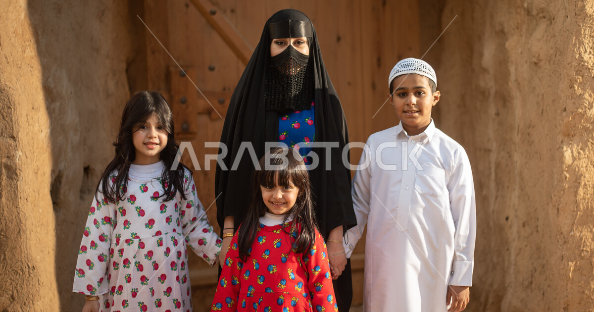 A group of Saudi Arab people in the old Saudi neighborhoods, the day of ...