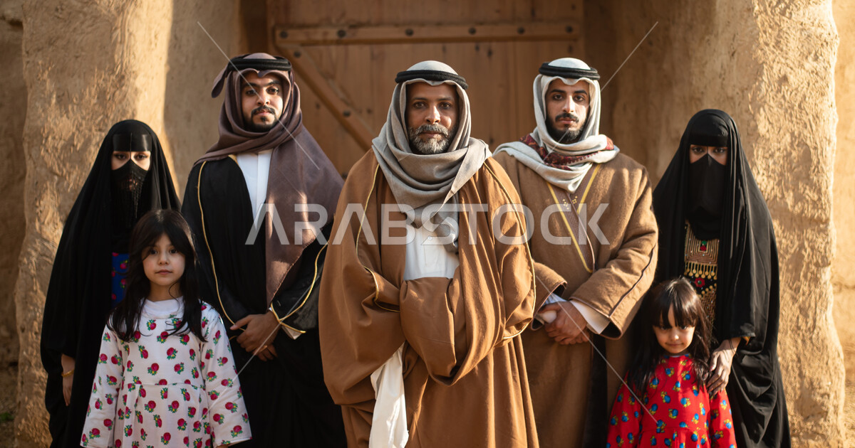 A group of Saudi Arab people in the old Saudi neighborhoods, the day of ...
