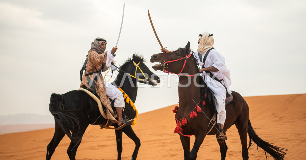 Two Saudi Arabian Gulf knights dressed in traditional costumes and ...