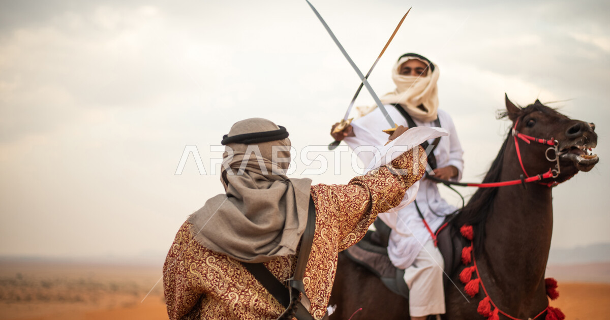Two Saudi Arabian Gulf knights riding horses in the Saudi desert and ...