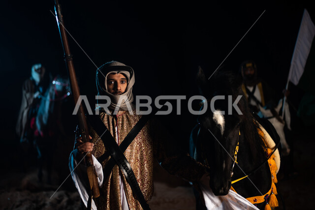 A Saudi Arab Gulf knight wearing a traditional folk costume and ...
