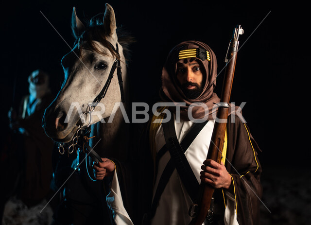 A Saudi Arab Gulf knight wearing a traditional folk costume and ...
