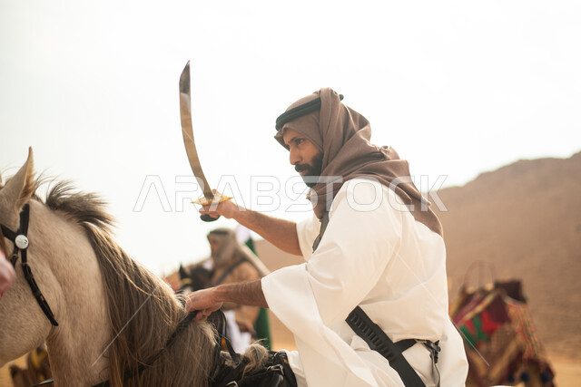 A Saudi Arabian Khaleeji knight riding the Arabian horse in the Saudi ...