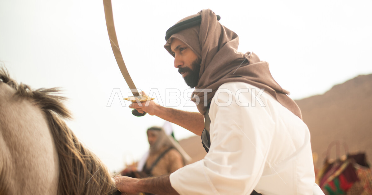 A Saudi Arabian Khaleeji knight riding the Arabian horse in the Saudi ...