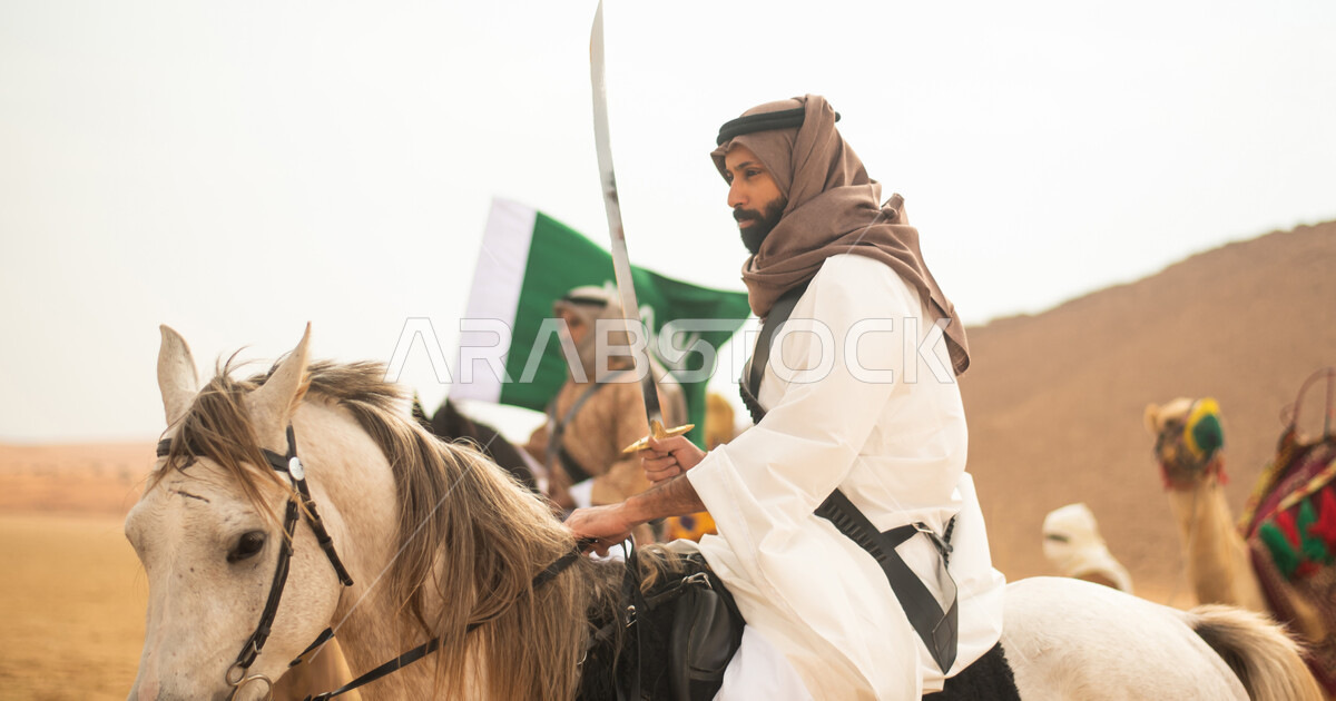 Saudi Arabian Gulf knights riding Arabian horses in the Saudi desert ...
