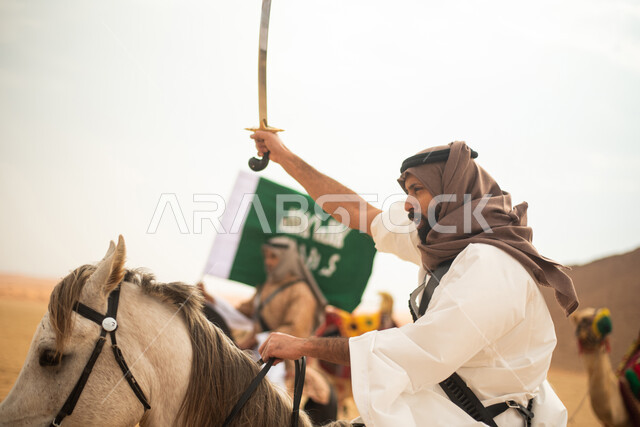 Saudi Arabian Gulf knights riding Arabian horses in the Saudi desert ...