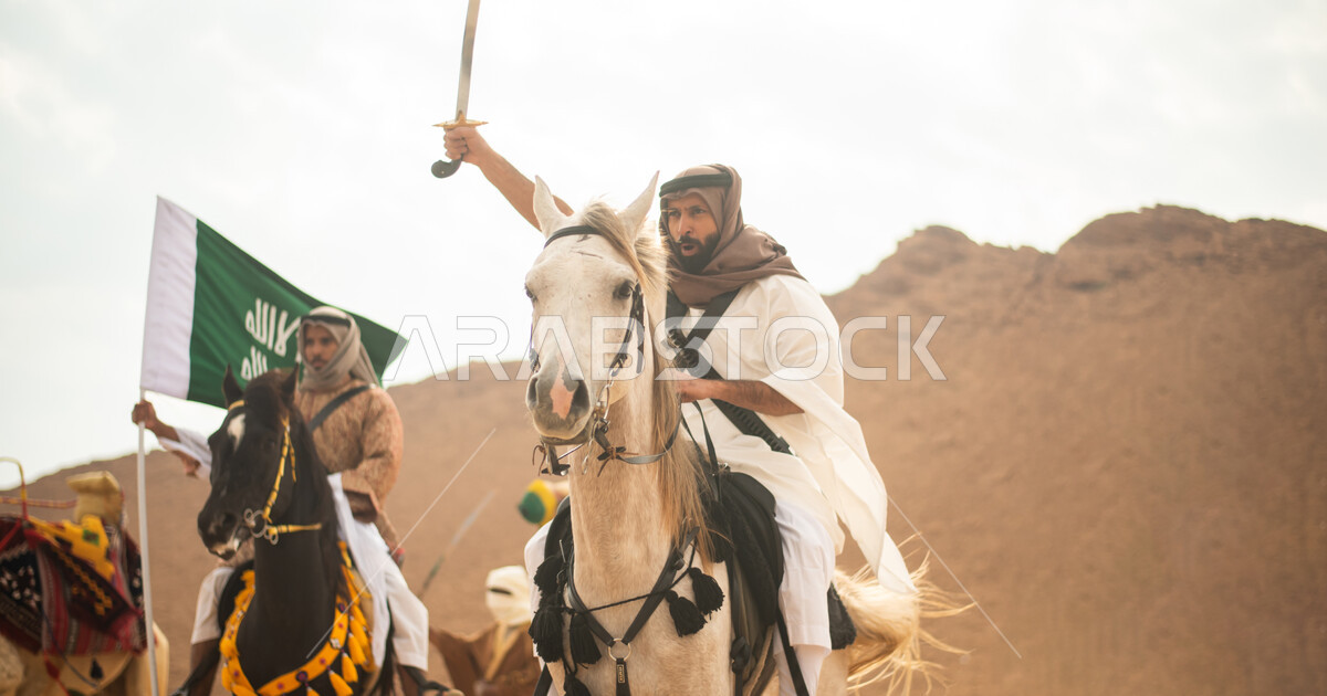 Saudi Arabian Gulf knights riding Arabian horses in the Saudi desert ...