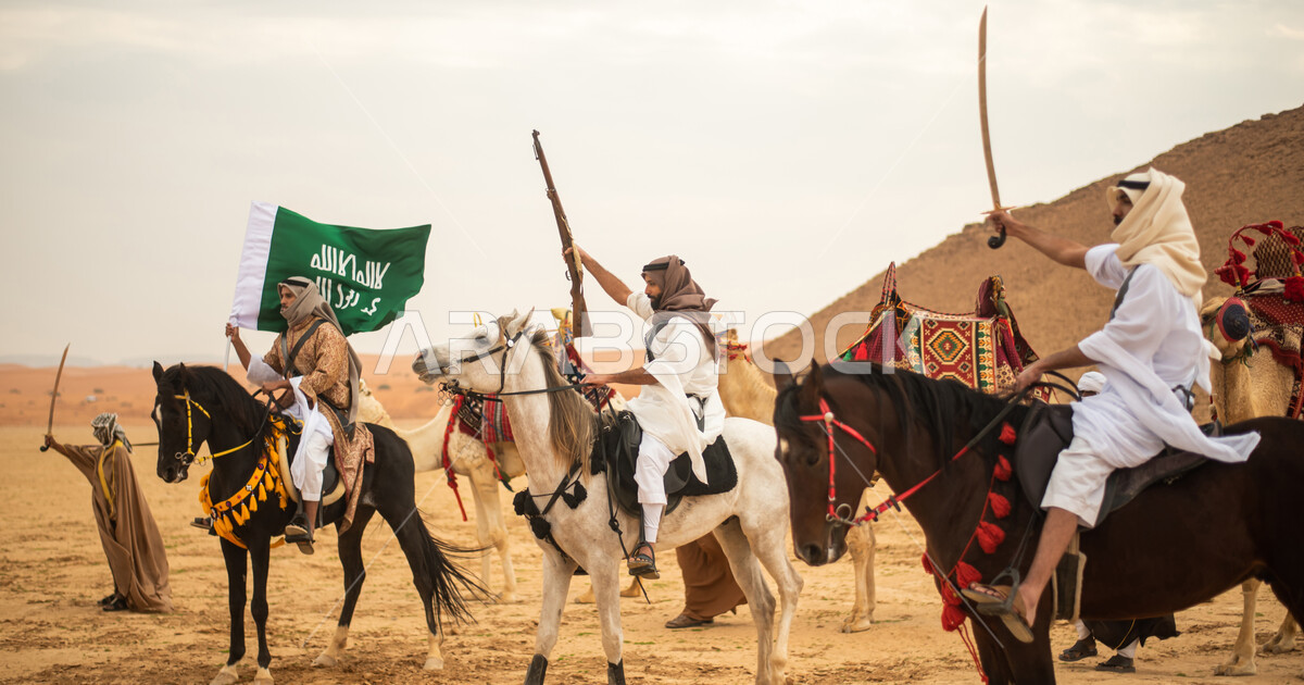 Saudi Gulf Arab knights riding horses in the Saudi desert, using swords ...