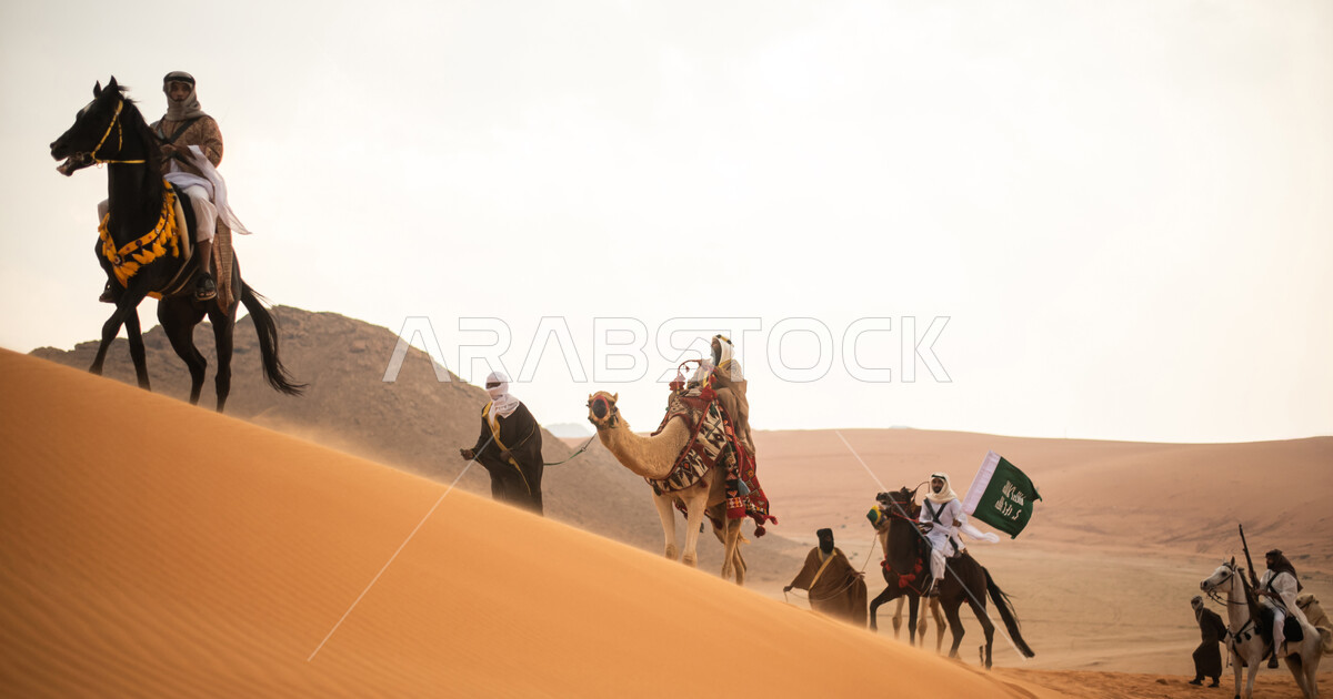 Saudi Gulf Arab knights riding horses in the Saudi desert, wearing ...