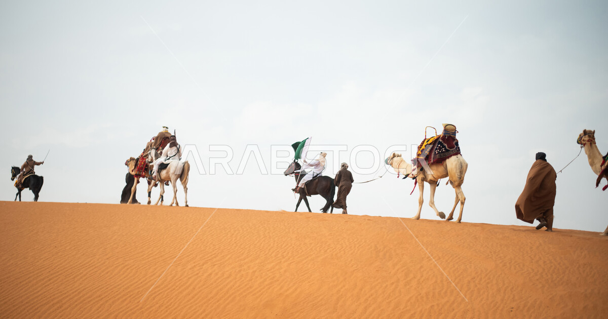 Saudi Gulf Arab knights riding horses in the Saudi desert, wearing ...