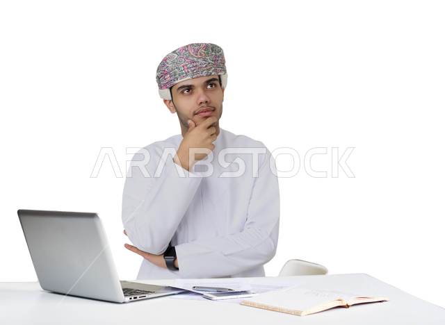 An Arab, Omani, Gulf man in traditional dress, making facial gestures ...