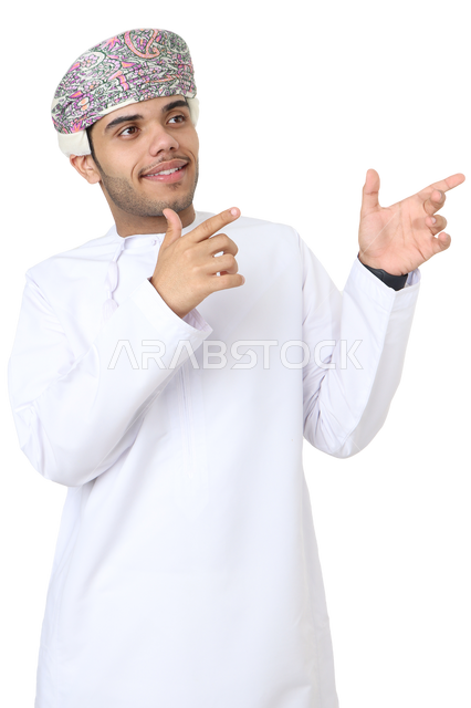 Portrait of an Arab Omani Gulf man in traditional dress, pointing his ...