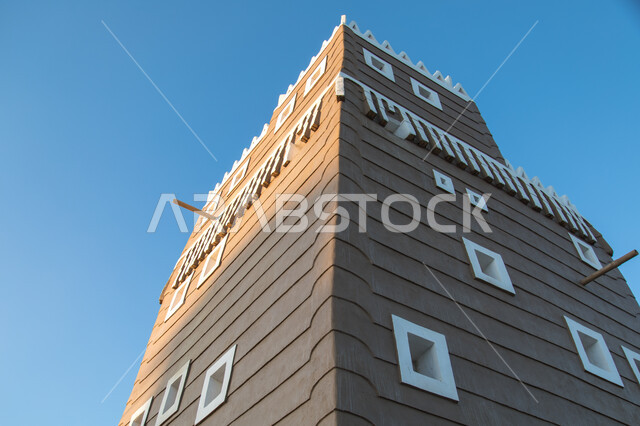 An old and restored heritage house with white windows in the Asir ...