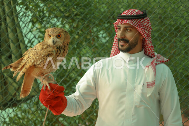 A Saudi Arabian Gulf man in the zoo in the Kingdom of Saudi Arabia ...