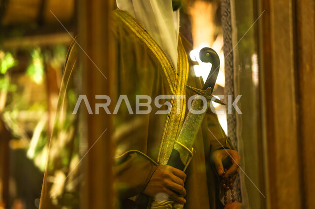A close-up of a Saudi Arabian Gulf man wearing a Saudi traditional ...