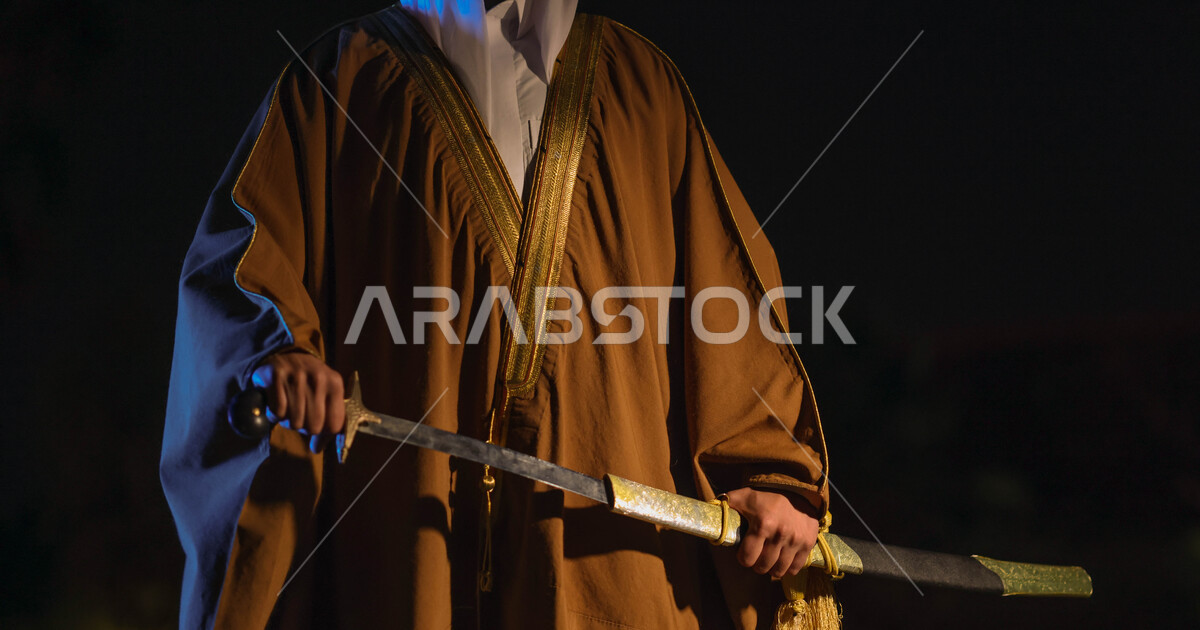 A Saudi Arab Gulf man wears a Saudi traditional costume for national ...