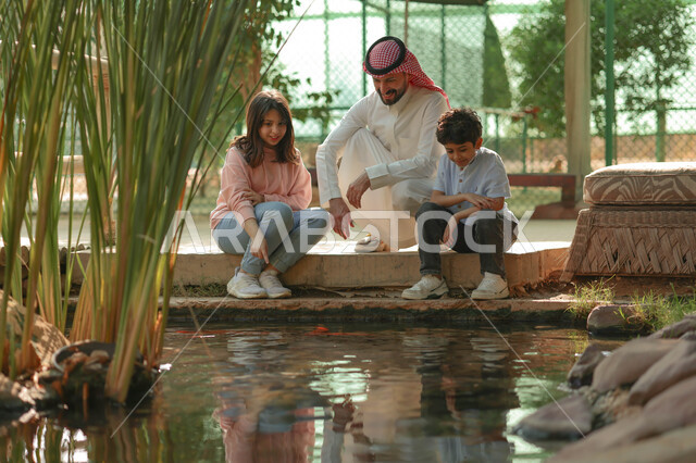 A Saudi Gulf Arab family spends fun times in the zoo in Saudi Arabia, a ...