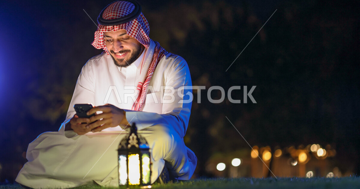 A Saudi Arabian Gulf man using a mobile phone, social networking ...