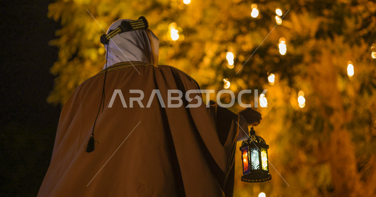 A picture from the back of a Saudi Arabian Gulf man wearing a Saudi ...