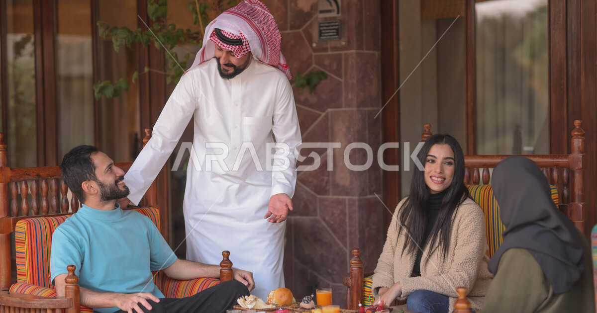 Saudi Gulf Arab friends enjoying an exchange of conversation in a Saudi ...