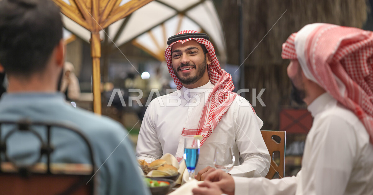 Saudi Gulf Arab youth enjoying an exchange of conversation in a Saudi ...