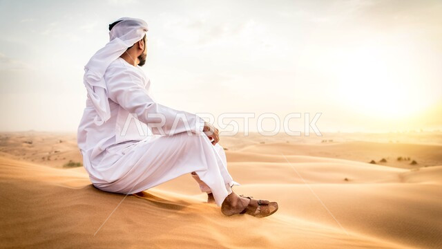 Emirati Gulf Arab man in desert areas, desert environment, sand dunes ...