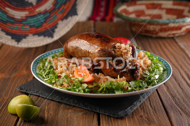Popular rice dish with stuffed pigeons, Arabic food, oriental ...