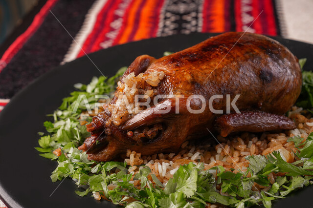 Popular rice dish with stuffed pigeons, Arabic food, oriental ...