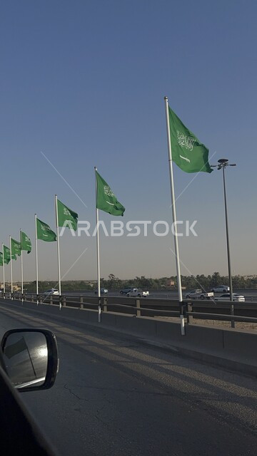 Saudi flags, Saudi roads and streets, the Saudi national flag flying ...