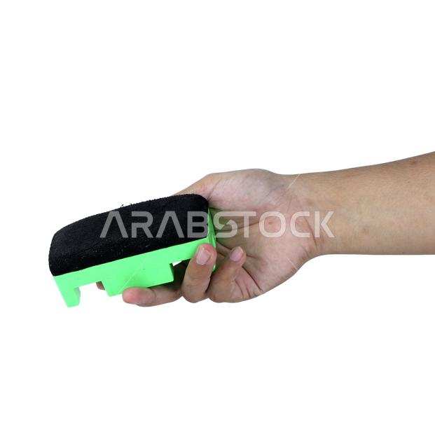A close-up of a hand holding a whiteboard area, a sponge area for ...