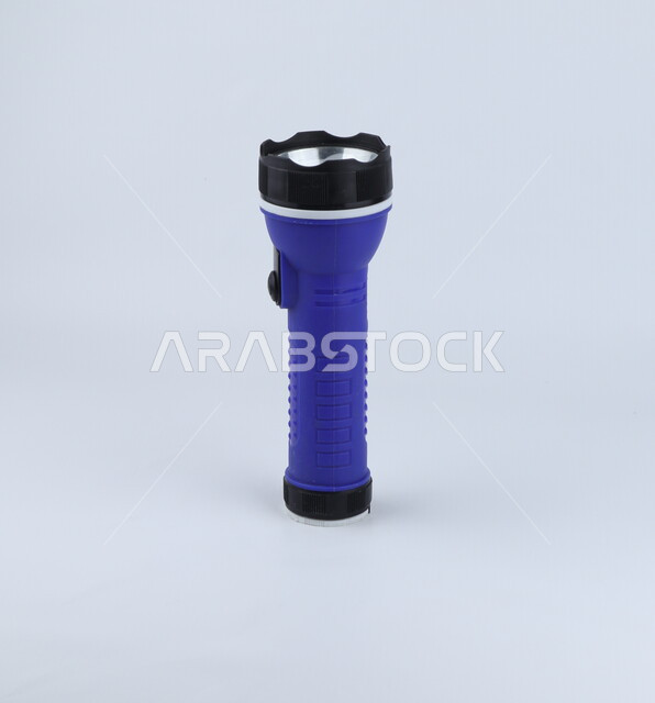 Blue flashlight isolated on a white background, searchlight, electric ...