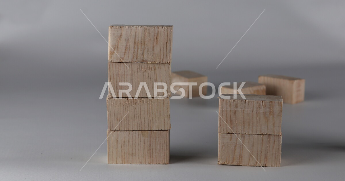 A group of stacked wooden blocks, wooden cubes, white background ...