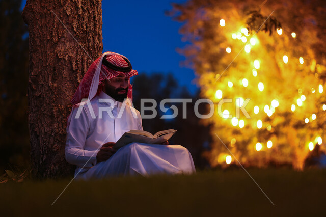 A Saudi Arabian Gulf man spending pleasant times in a public park ...
