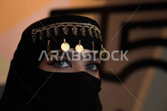 A close-up of a Saudi Arabian Gulf woman wearing the niqab, wearing a ...