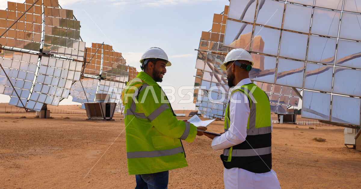 Two Saudi Arabian Gulf engineers supervising solar power plants ...