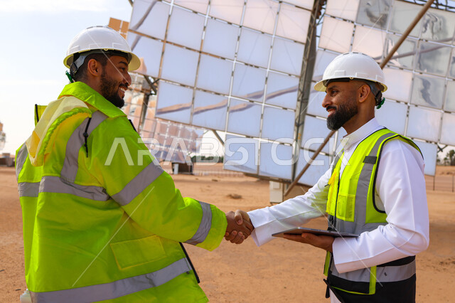 Two Saudi Arabian Gulf engineers supervising solar power plants ...